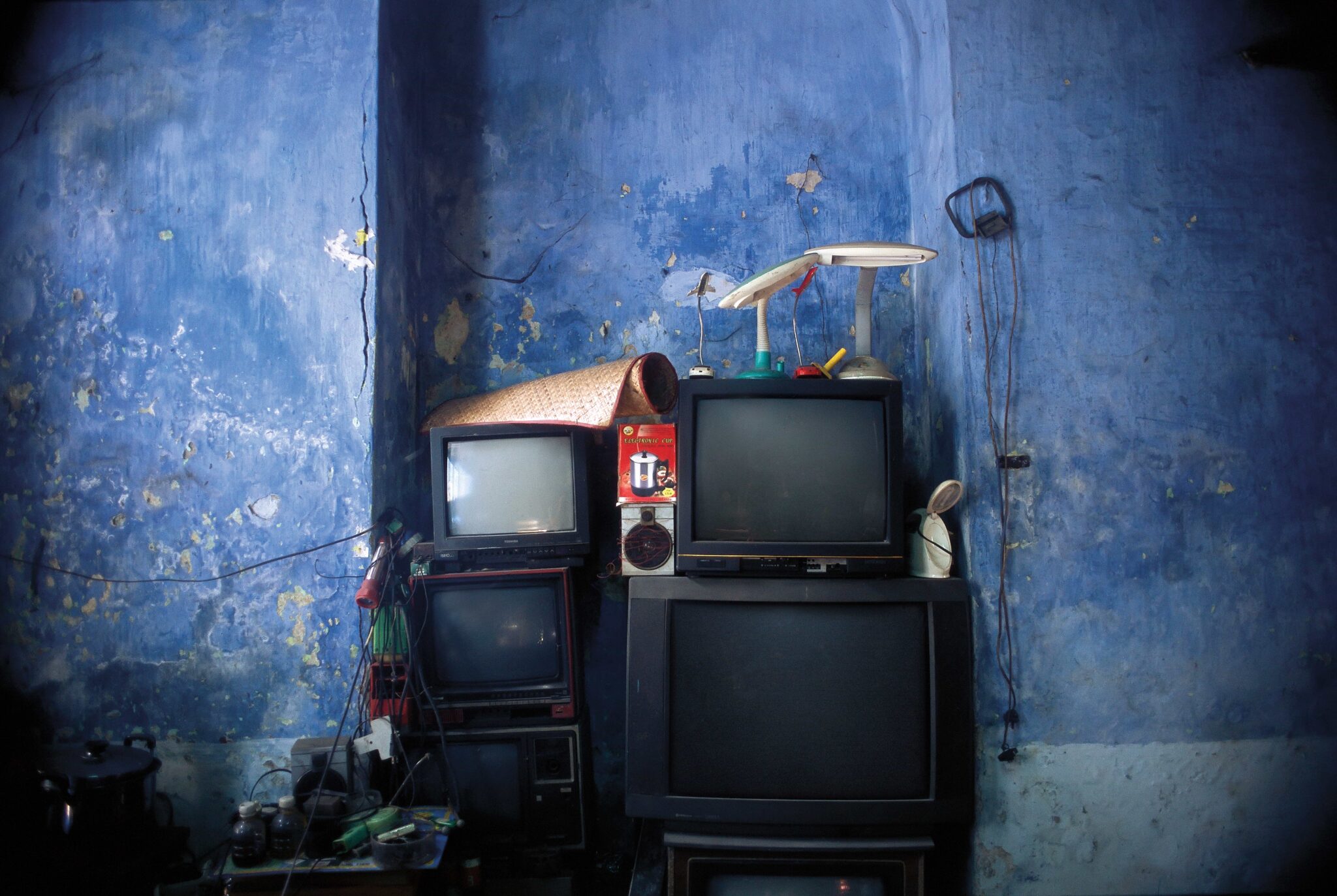 10_Still life with blue arcade, stacked televisions and percolator - Art Gallery